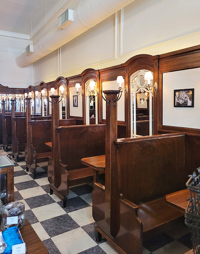 Polished wooden booths with intimate lighting create the perfect setting for ice cream rendezvous – where first dates and family traditions have unfolded for generations.