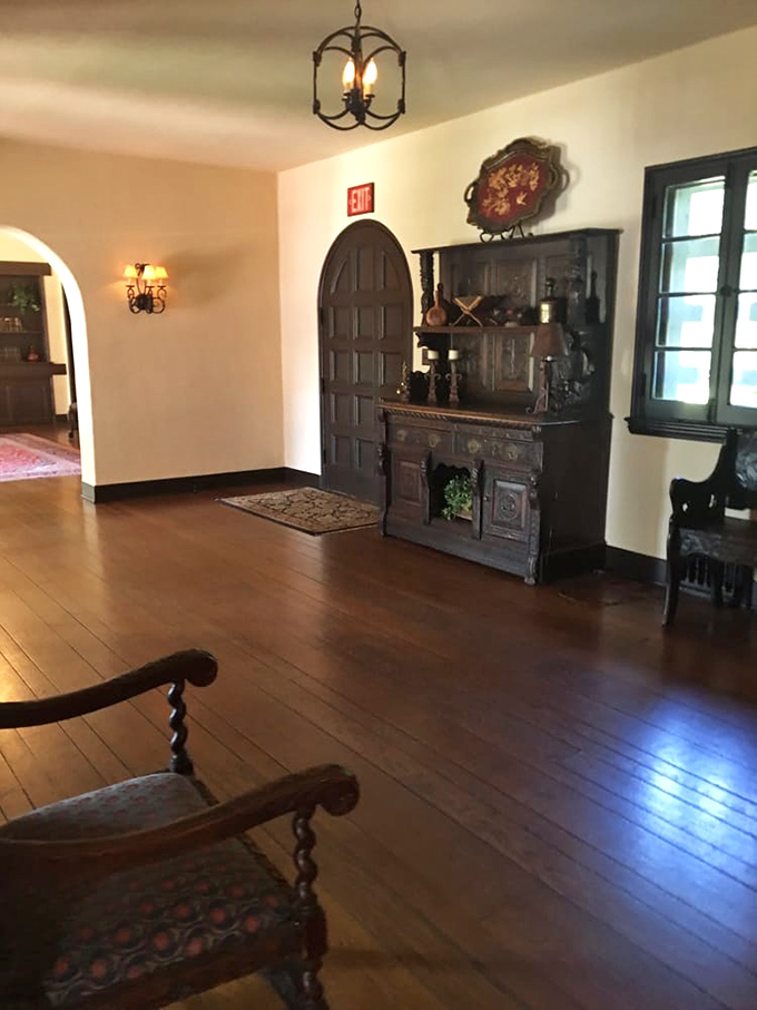 Step inside and the Old World wraps around you like a warm embrace, all dark wood and careful craftsmanship that modern builders forgot how to replicate.