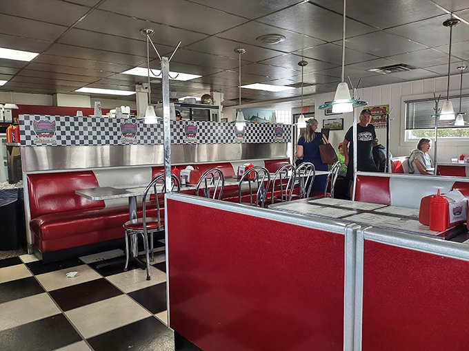 Classic red vinyl booths and checkerboard floors transport diners straight back to the 1950s, no DeLorean required.