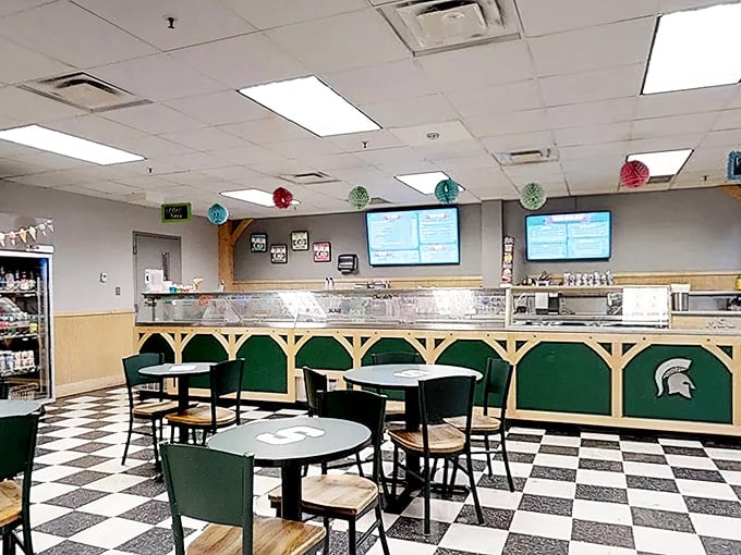 Black and white checkered floors meet Spartan green decor in this beloved campus hangout where dairy dreams come true.