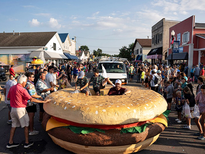 This colossal burger float commands the street like a beefy monarch, drawing gasps and giggles from the parade-watching crowd.