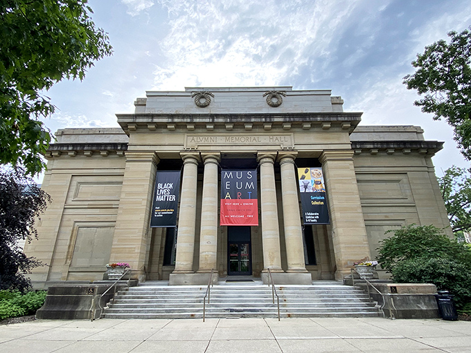 The stately Alumni Memorial Hall houses the University of Michigan Museum of Art, where classical columns stand guard over treasures that span continents and centuries.