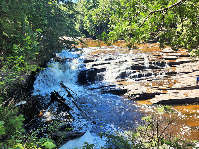Nawadaha Falls tumbles playfully over ancient stone steps, like Mother Nature's version of a perfectly designed water feature.
