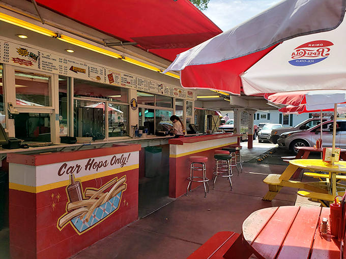 "Car Hops Only!" declares the counter where culinary dreams come true, a time portal to when service came with a smile instead of a smartphone app.