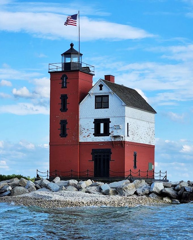 Up close, the lighthouse reveals its charming architectural details &ndash; that red tower practically winking at passing boats like a maritime celebrity.