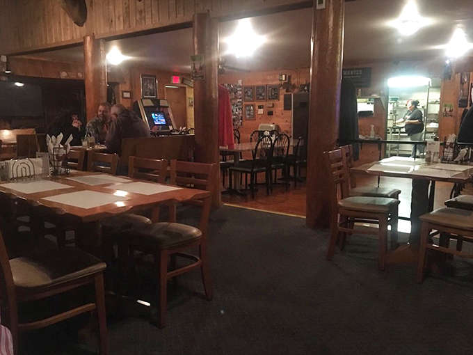 Warm wood paneling and rustic charm define the interior, where fishing tales grow taller with each telling.