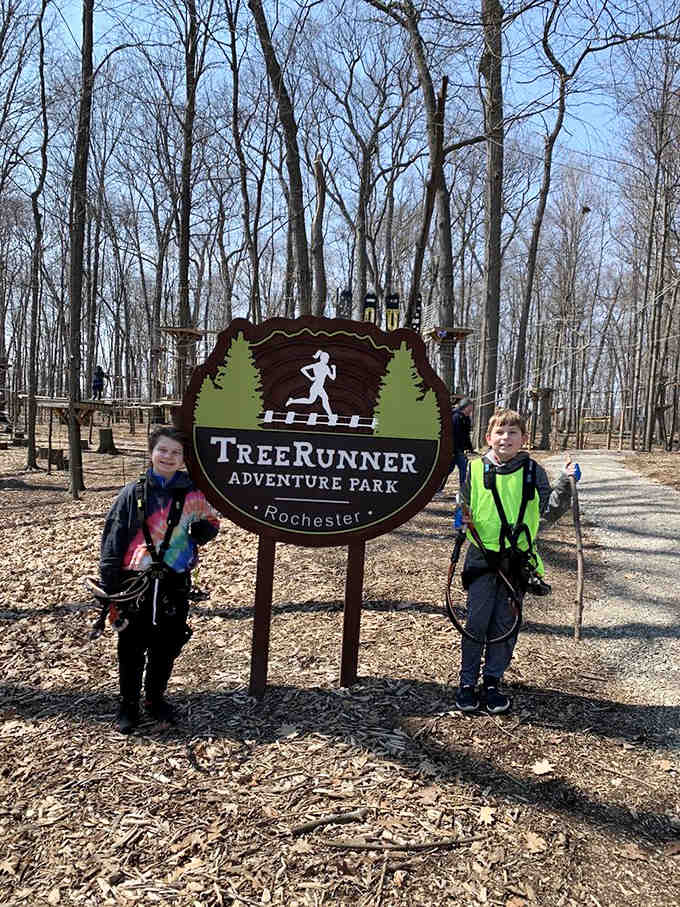 The TreeRunner Rochester Adventure Park sign stands proudly, promising thrills and challenges for visitors of all courage levels.