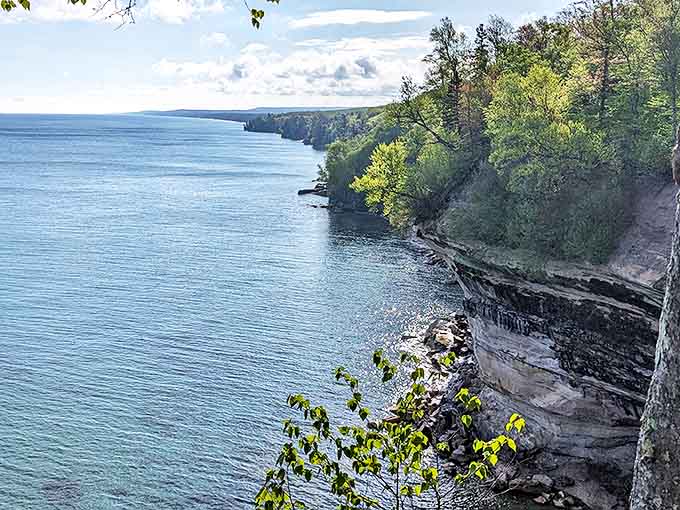 From this eagle's vantage point, Pictured Rocks' dramatic cliffs frame the coastline like nature's own masterpiece gallery.