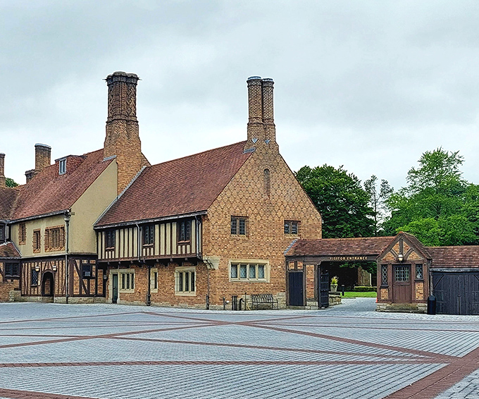The visitor entrance welcomes guests with a blend of brick, stone, and timber that whispers, "Yes, automobile money built this, thank you for noticing!"
