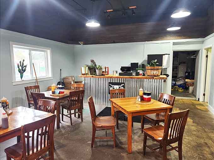 Simple wooden tables and corrugated metal accents create an unpretentious dining space where the food rightfully takes center stage.