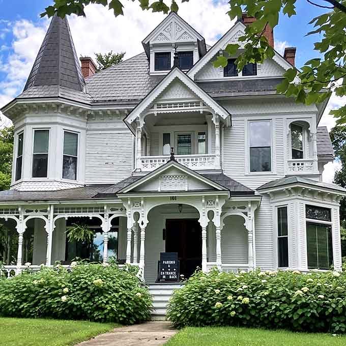 Architectural details that would make modern builders weep &ndash; intricate gingerbread trim, balanced proportions, and that magnificent wraparound porch invite lingering.