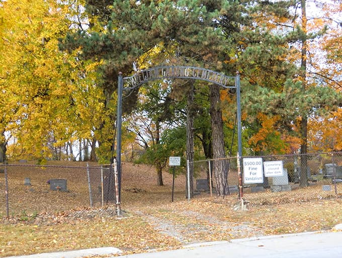 The entrance to William Ganong Cemetery frames a view that instantly transports you back to Michigan's pioneer days, minus the horse-drawn carriages.