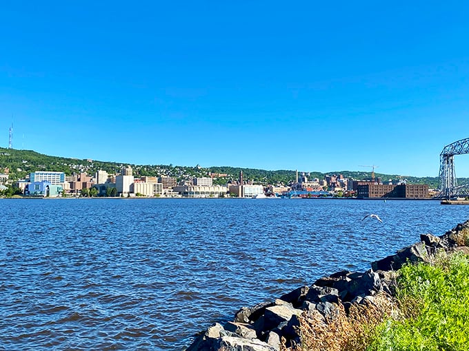 Duluth's harbor embraces Lake Superior with industrial charm, where massive freighters and small pleasure craft share the same magnificent watery playground.