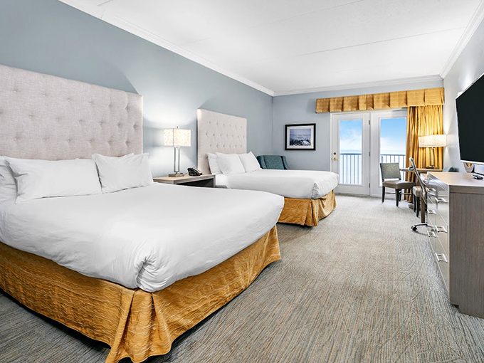 Cloud-like beds with crisp linens face floor-to-ceiling windows, because counting waves beats counting sheep any night of the week.