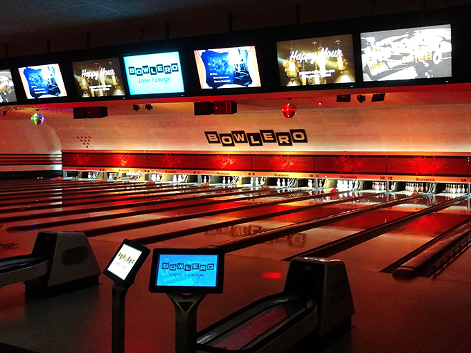 Under cosmic lighting, Bowlero transforms into a neon playground where strikes and spares become part of the light show.