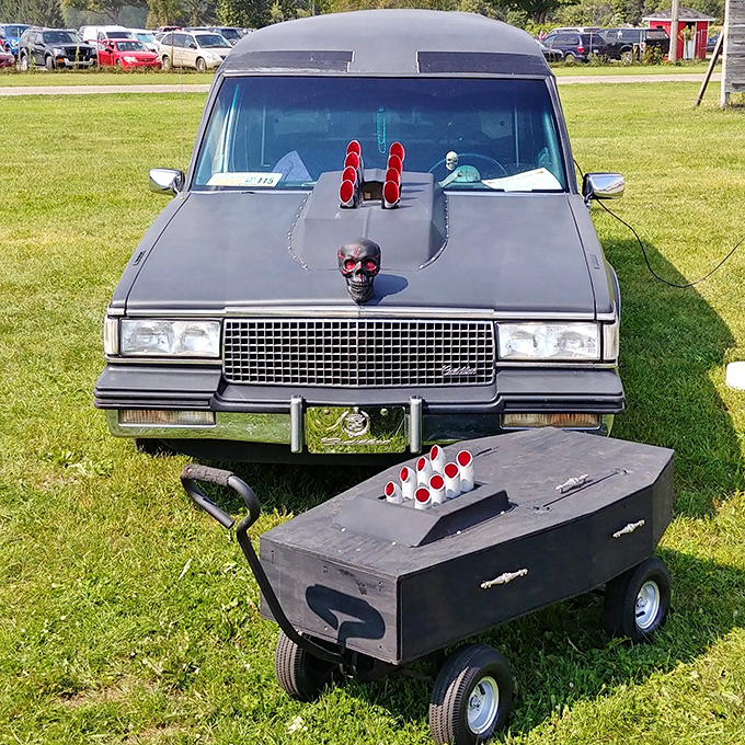 Custom 1988 Cadillac hearse: This menacing midnight chariot sports a skull ornament and red accents &ndash; luxury transportation for the discerning departed.