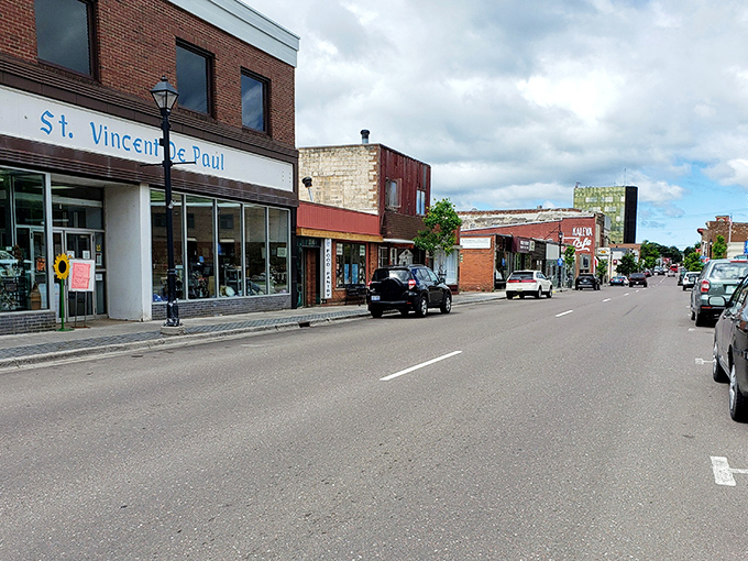 Downtown Hancock maintains its historic charm with brick buildings housing local businesses, including the St. Vincent de Paul thrift store.