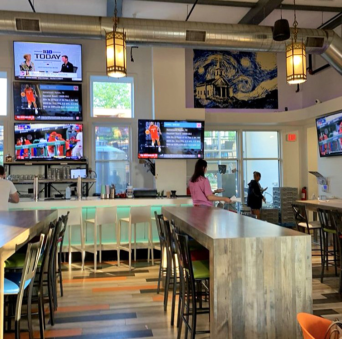 Soaring ceilings and pendant lighting create a reverent atmosphere where the altar of beer brings people together instead of Sunday sermons.