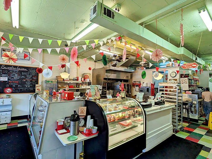 Step inside and the festive pennant banners, checkerboard floor, and vintage display case transport you to a time when calories were just numbers nobody bothered counting.