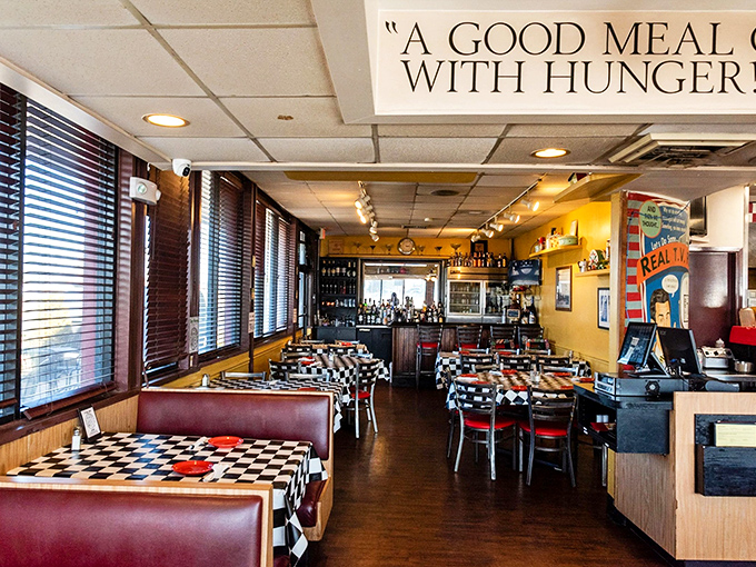 Step into a time machine where black-and-white tiles meet warm yellow walls, creating that perfect nostalgic atmosphere that makes you instantly hungry.