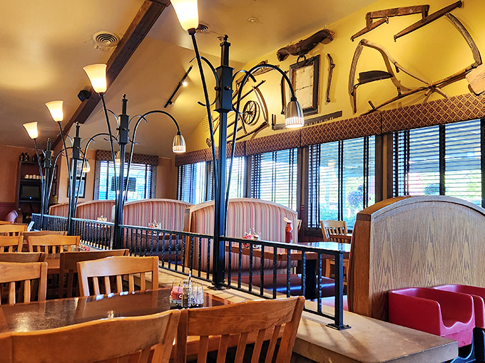 Rustic farm implements hang from the ceiling, creating a country charm that perfectly complements the hearty meals served below.