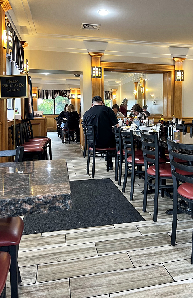 Inside, warm wood tones and comfortable seating create the perfect backdrop for morning conversations and coffee refills.