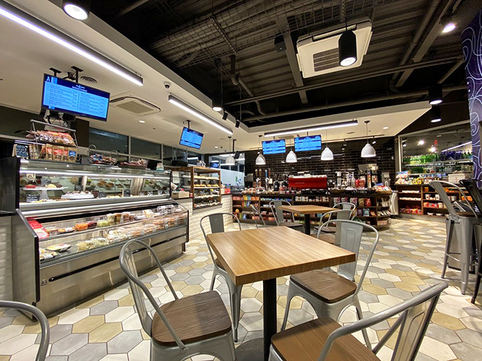 Inside, the market transforms from gas station to gourmet haven, with display cases and modern industrial touches that signal this isn't your average convenience store.