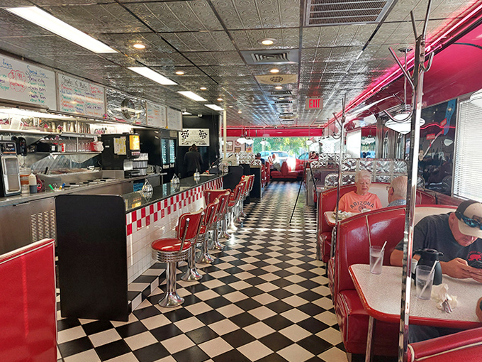 Classic checkerboard floors play visual tag with cherry-red vinyl booths while chrome accents transport diners to a time when restaurants had personality.