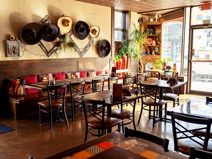 Warm wooden tables, decorative sombreros, and vibrant red cushions create an atmosphere that's both cozy and festive &ndash; like dining in Mexico without the passport.