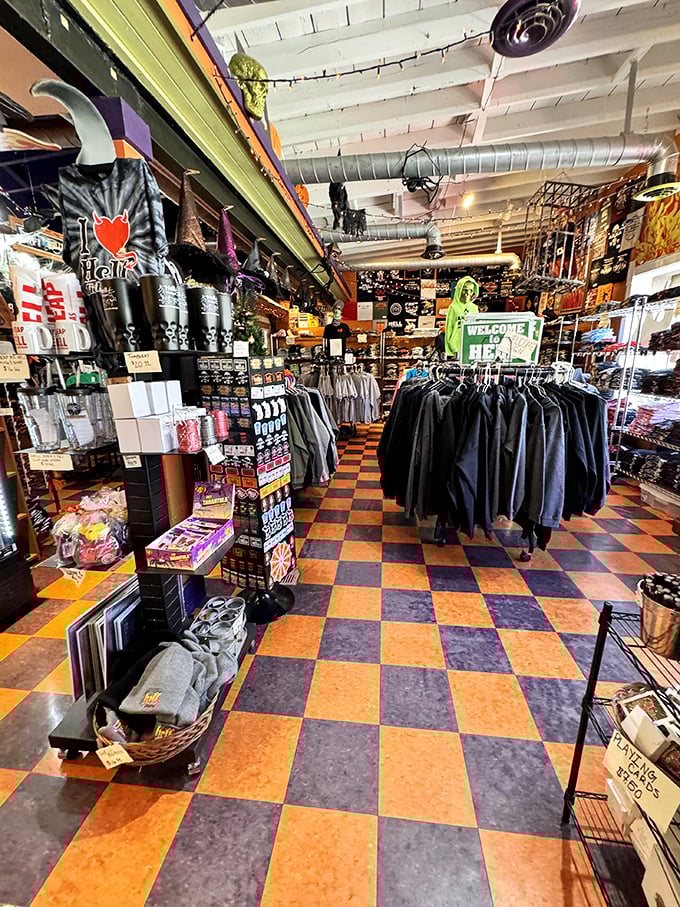 The iconic orange and black checkered floor sets the stage for a retail experience where horror meets humor. Even the merchandise seems to be having a wickedly good time.
