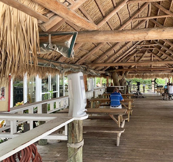 Rustic wooden beams and swaying palm fronds overhead &ndash; nature's air conditioning with a side of island ambiance that money can't manufacture.