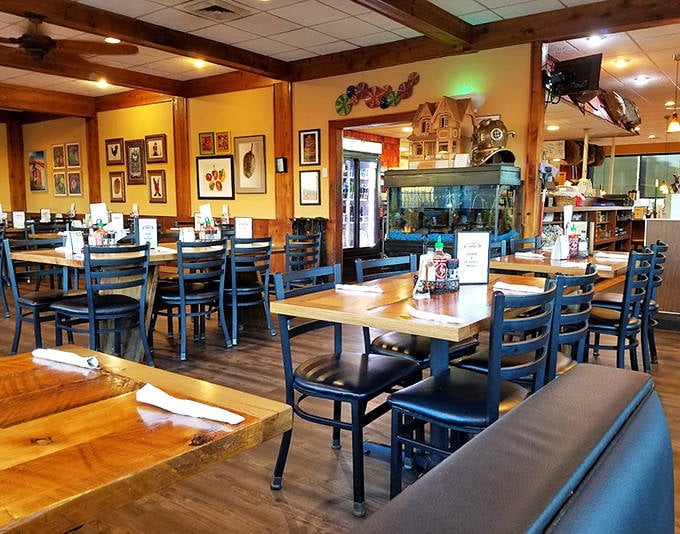 Warm wood tones and blue chairs create that perfect "fancy-casual" vibe&mdash;like your coolest friend's dining room, but with better food.