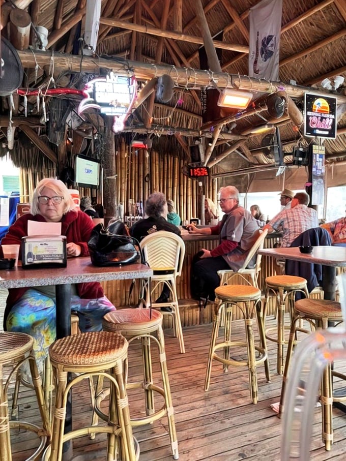 Inside Ka'Tiki, bamboo poles and thatched ceilings create an authentic tiki atmosphere where island time rules and worries melt away.