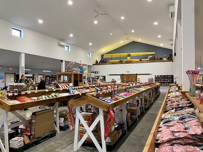 Candy paradise unfolds inside with soaring ceilings and meticulously organized wooden display tables stretching as far as the eye (and sweet tooth) can see.