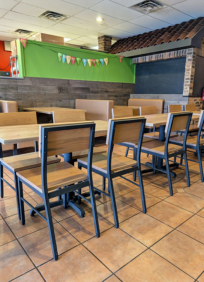 Wooden tables, colorful banners, and warm green walls create an atmosphere that's both festive and comfortable &ndash; like dining in a friend's exceptionally clean kitchen.