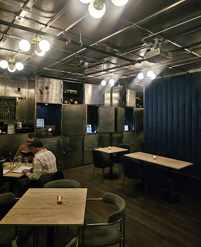 Intimate seating and moody lighting create the perfect speakeasy atmosphere, where conversations flow as smoothly as the cocktails.