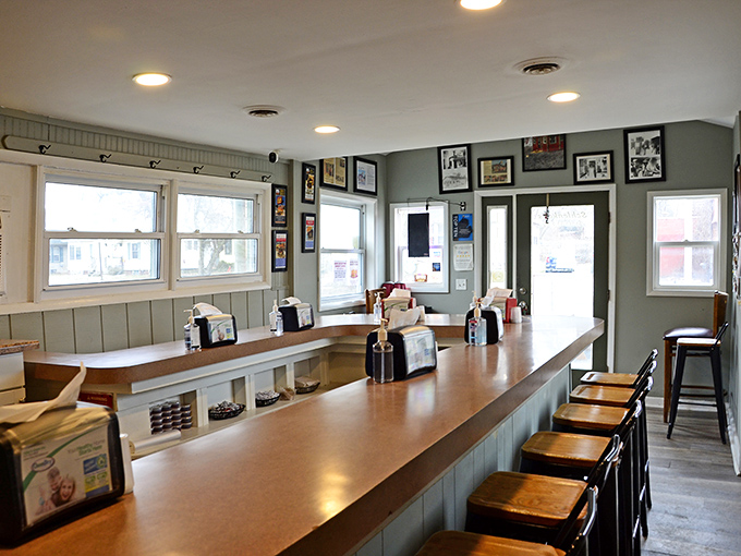 Counter seating that invites conversation &ndash; this isn't just dining, it's community gathering where burger enthusiasts share their passion elbow-to-elbow.