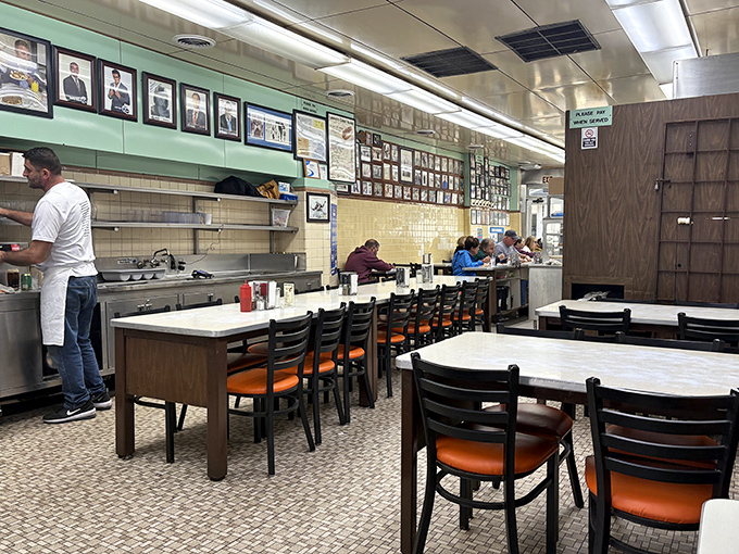 Simple, no-nonsense interior where culinary magic happens. The counter seating invites strangers to become friends over shared coney dog experiences.