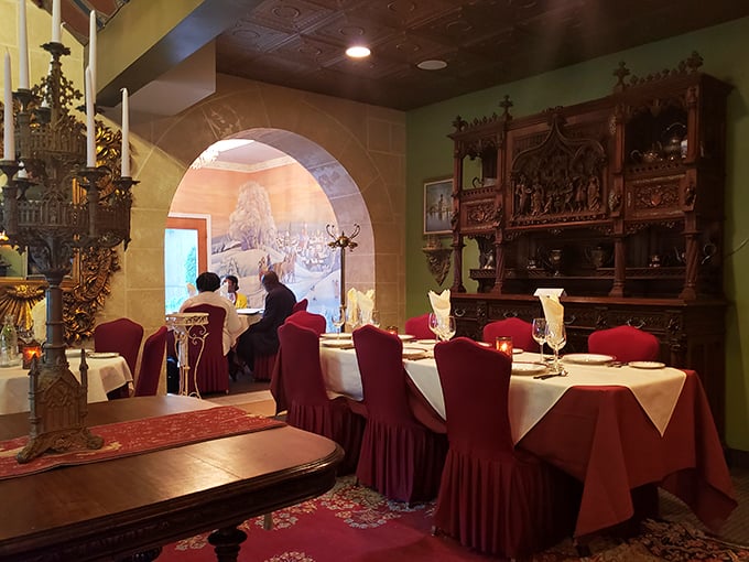 Step inside and time travel begins. Rich wood details, arched doorways, and crimson chairs set the stage for culinary theater.