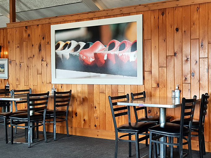 Warm wood paneling creates a cozy atmosphere where breakfast dreams come true and diet plans go to die.