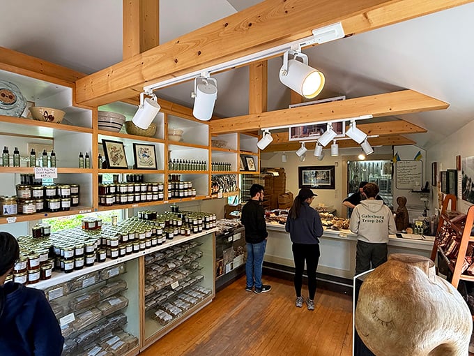 Inside, wooden beams and simple shelving create a rustic backdrop for the real stars: monastery-made baked goods and preserves that inspire devotion.