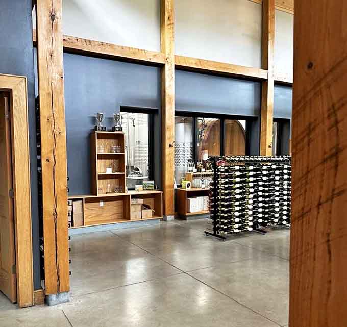 Rustic elegance defines the tasting room interior, where exposed wooden beams meet modern design, creating the perfect backdrop for wine discovery.