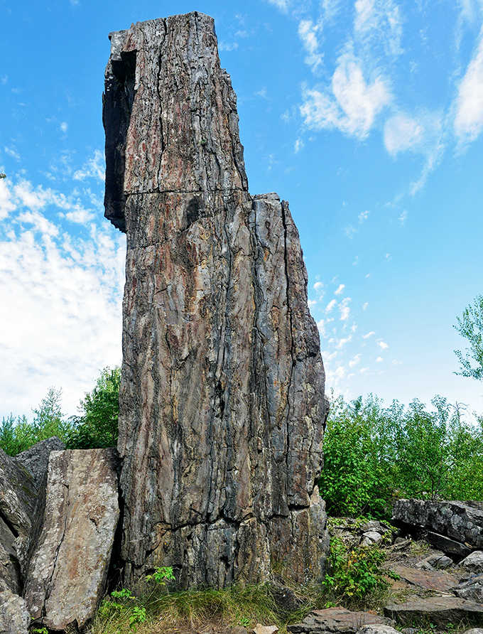 Nature's skyscraper reaches dramatically skyward, a 60-foot sentinel of ancient stone. Billions of years in the making, it commands both respect and wonder.