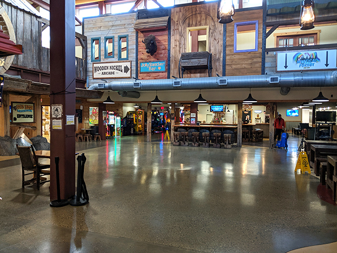 The main hall buzzes with energy as families navigate between attractions in this western-themed aquatic wonderland.