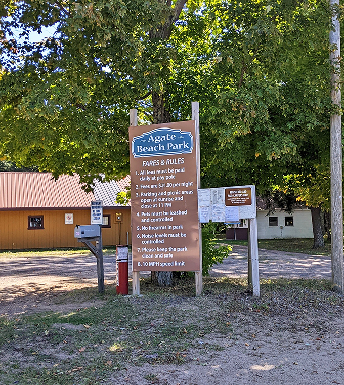 Rules of the rock hunt: This weathered sign welcomes visitors to Agate Beach Park, where geological wonders await the patient explorer.