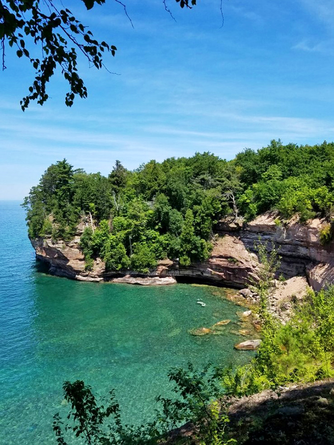 Mother Nature showing off her best work &ndash; turquoise waters meet dramatic sandstone cliffs in a scene that defies Midwestern expectations.