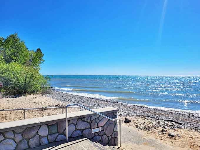 Morning light transforms Lake Huron into a canvas of blues, where the horizon blurs the boundary between water and sky.