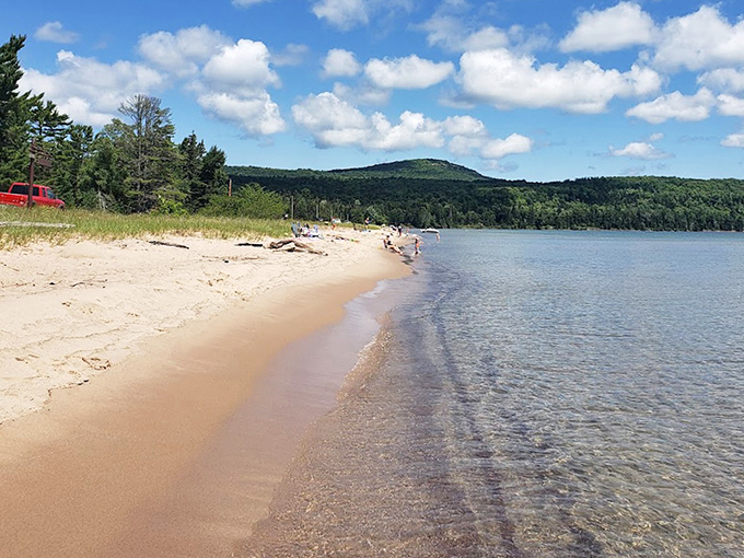 Sandy shores meet crystal waters so clear you'll wonder if Lake Superior secretly went to finishing school.
