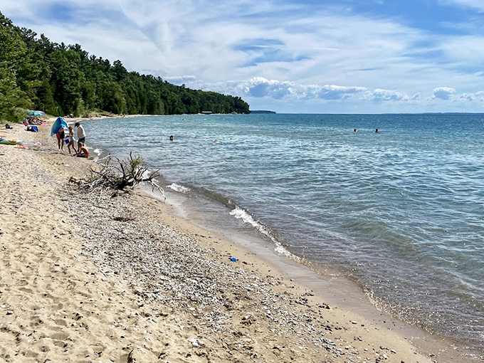 Shoreline serenity at its finest – where Lake Michigan masquerades as the Caribbean without the passport requirements or overpriced coconut drinks.