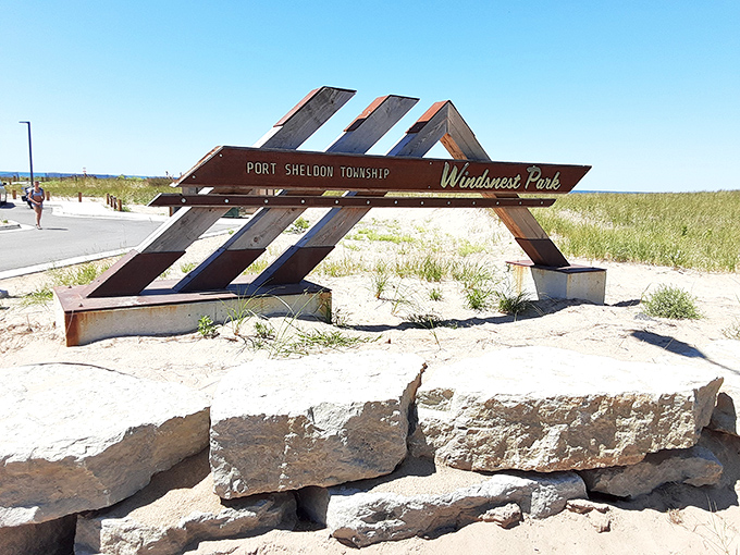 The rustic wooden sign welcomes in-the-know visitors to Port Sheldon Township's best-kept secret &ndash; no neon lights needed for this hidden gem.